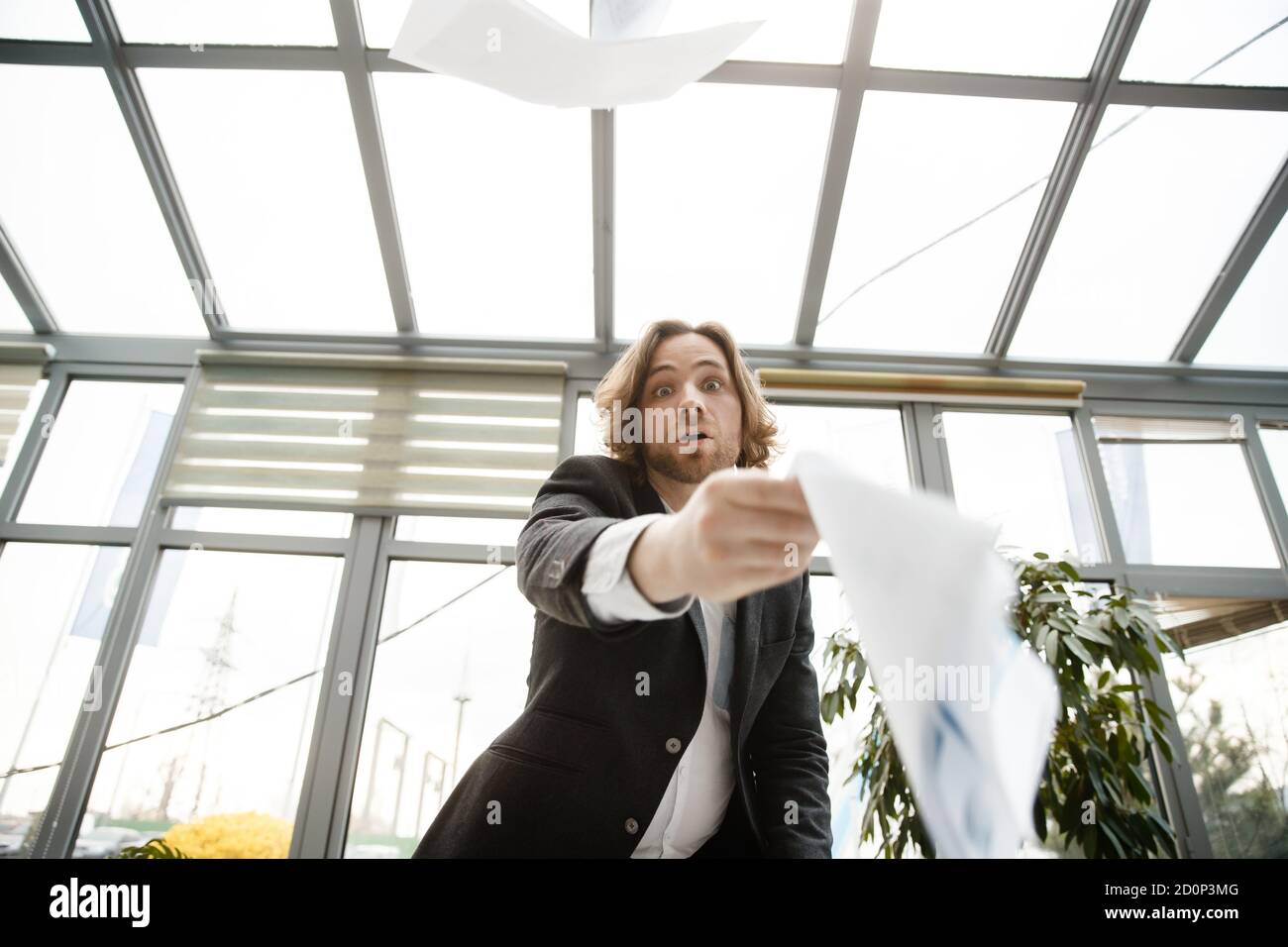 A man is stretching his hand at the camera. He is trying to catch ...