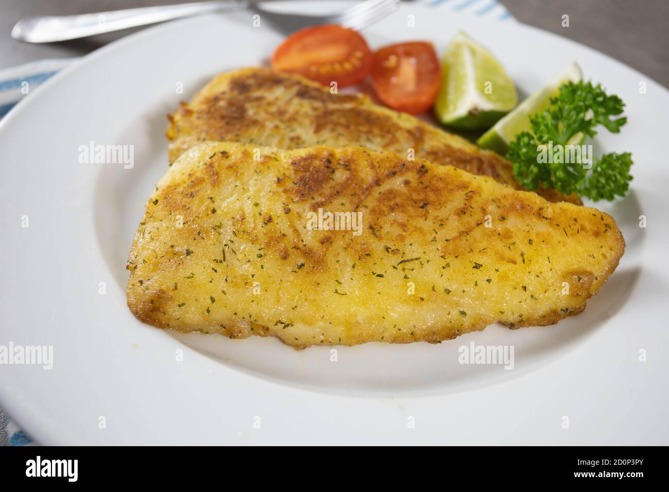Meunière fish fillet cooked on a plate Stock Photo - Alamy