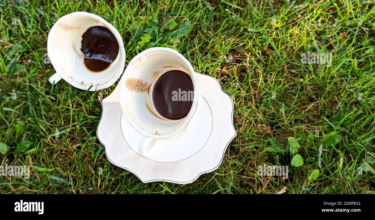 The cup of coffee on a morning grass image Stock Photo - Alamy