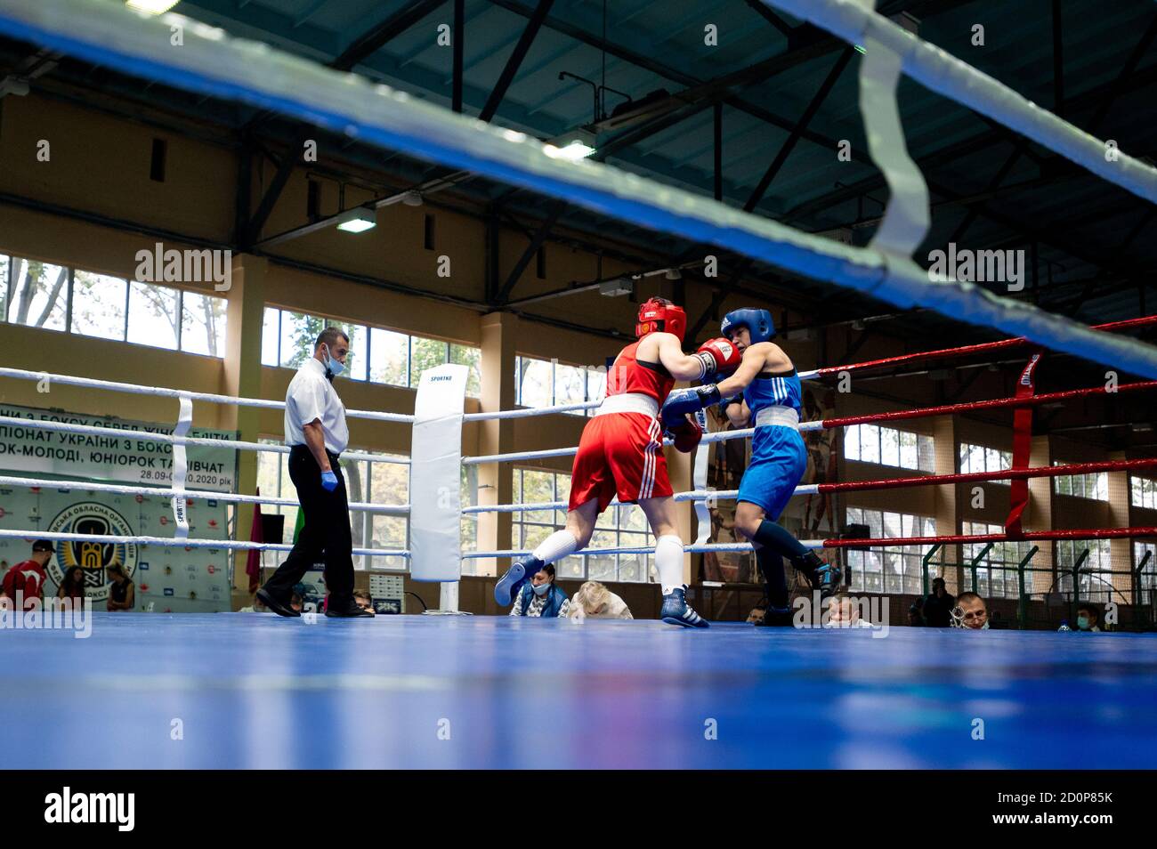 KHARKIV, UKRAINE - OCTOBER 2, 2020: Girls boxers in the fight on the ...