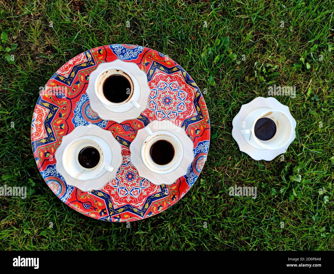 The cup of coffee on a morning grass image Stock Photo - Alamy