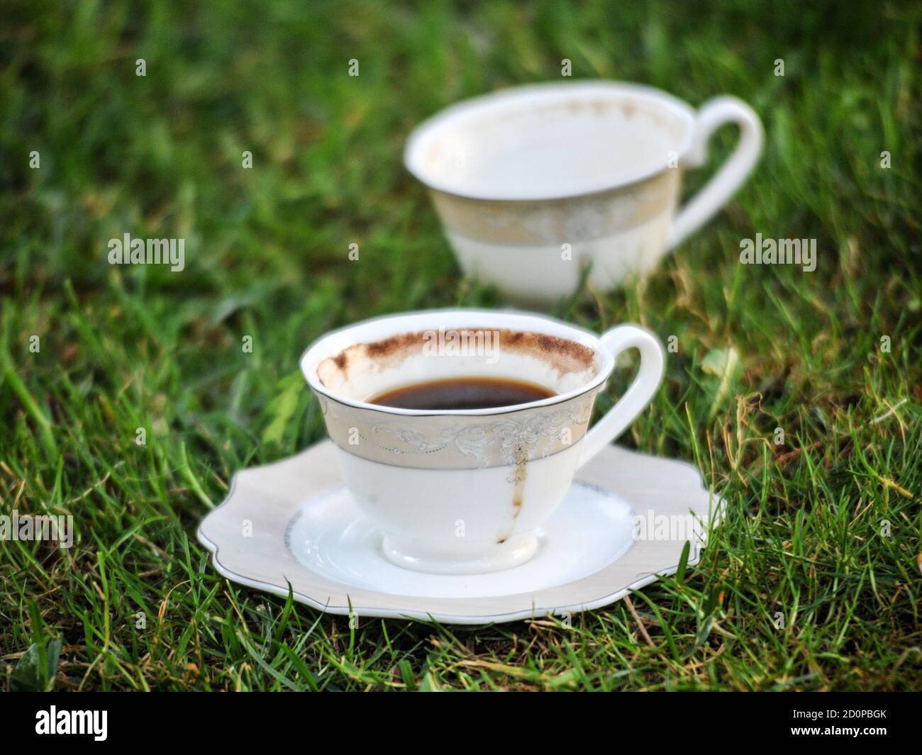 The cup of coffee on a morning grass image Stock Photo - Alamy