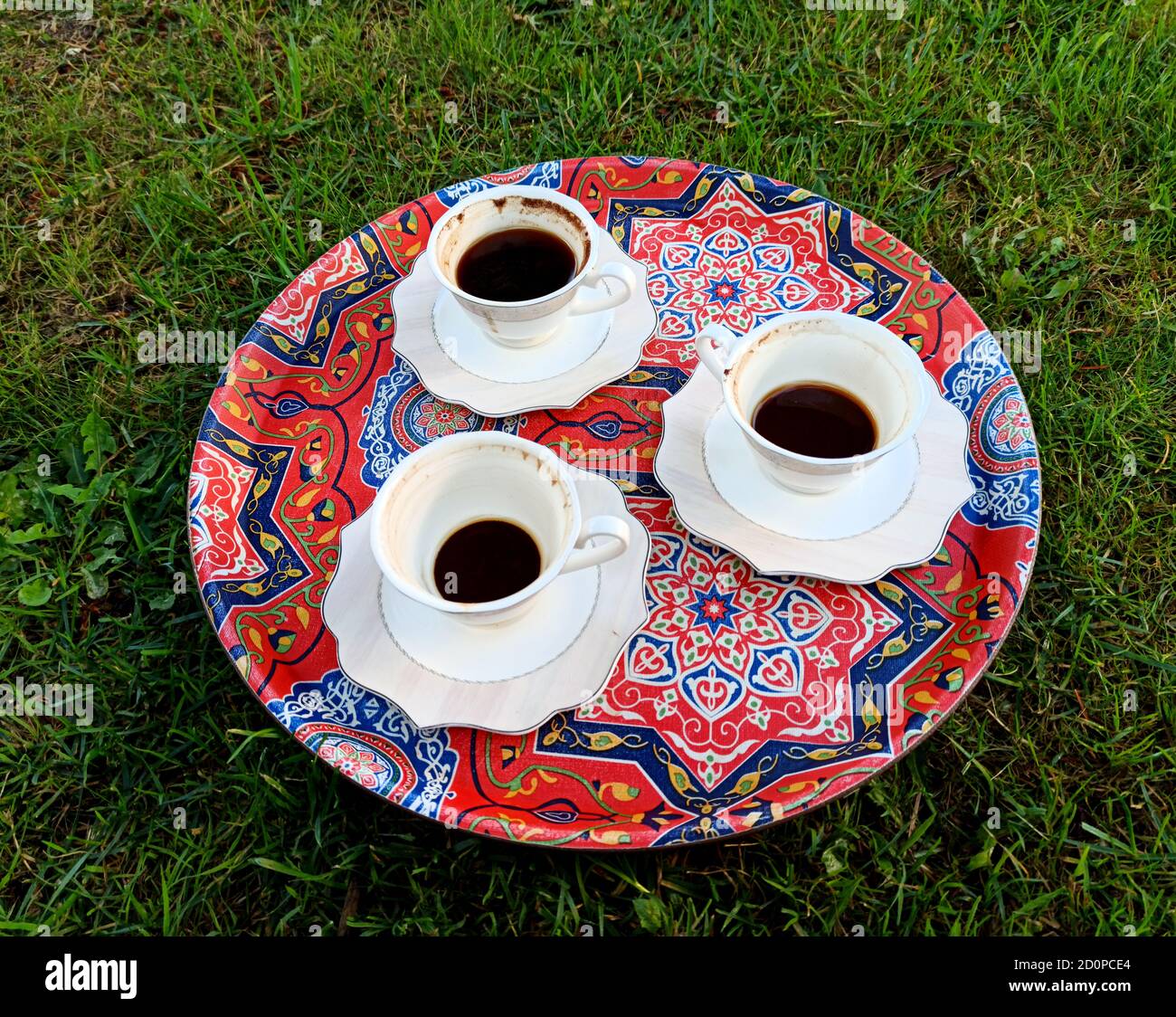 The cup of coffee on a morning grass image Stock Photo - Alamy