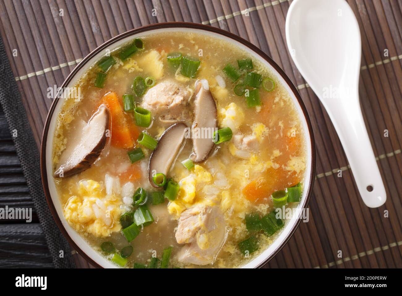 Zosui or ojiya is a mild and thin Japanese winter rice soup with egg ...