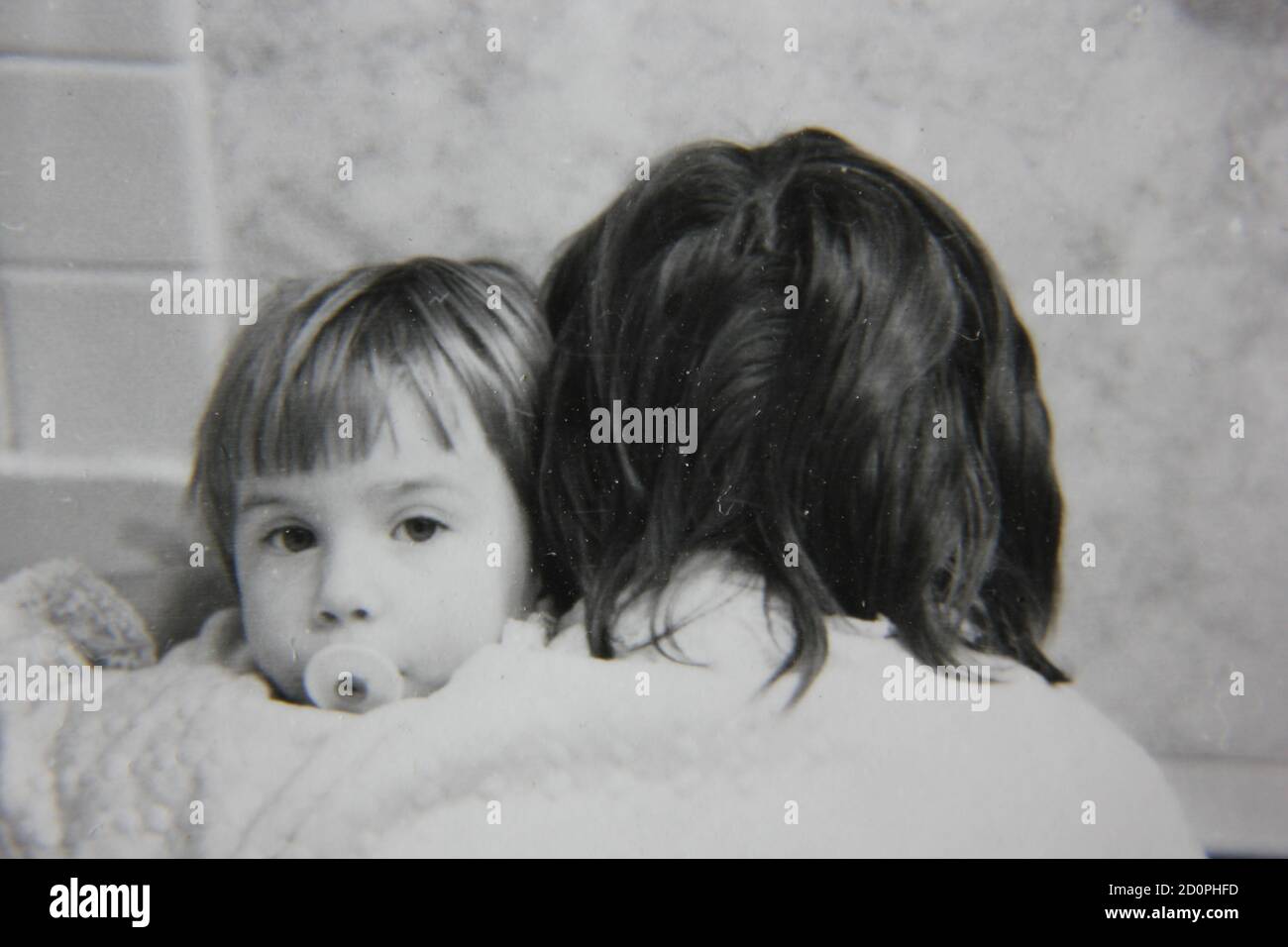 Fine 1970s vintage black and white photography of a mother parenting ...