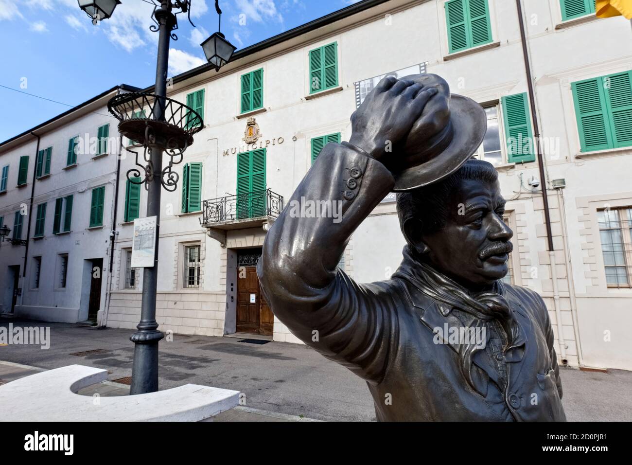 Brescello: the statue of Peppone and the town hall. The village is ...