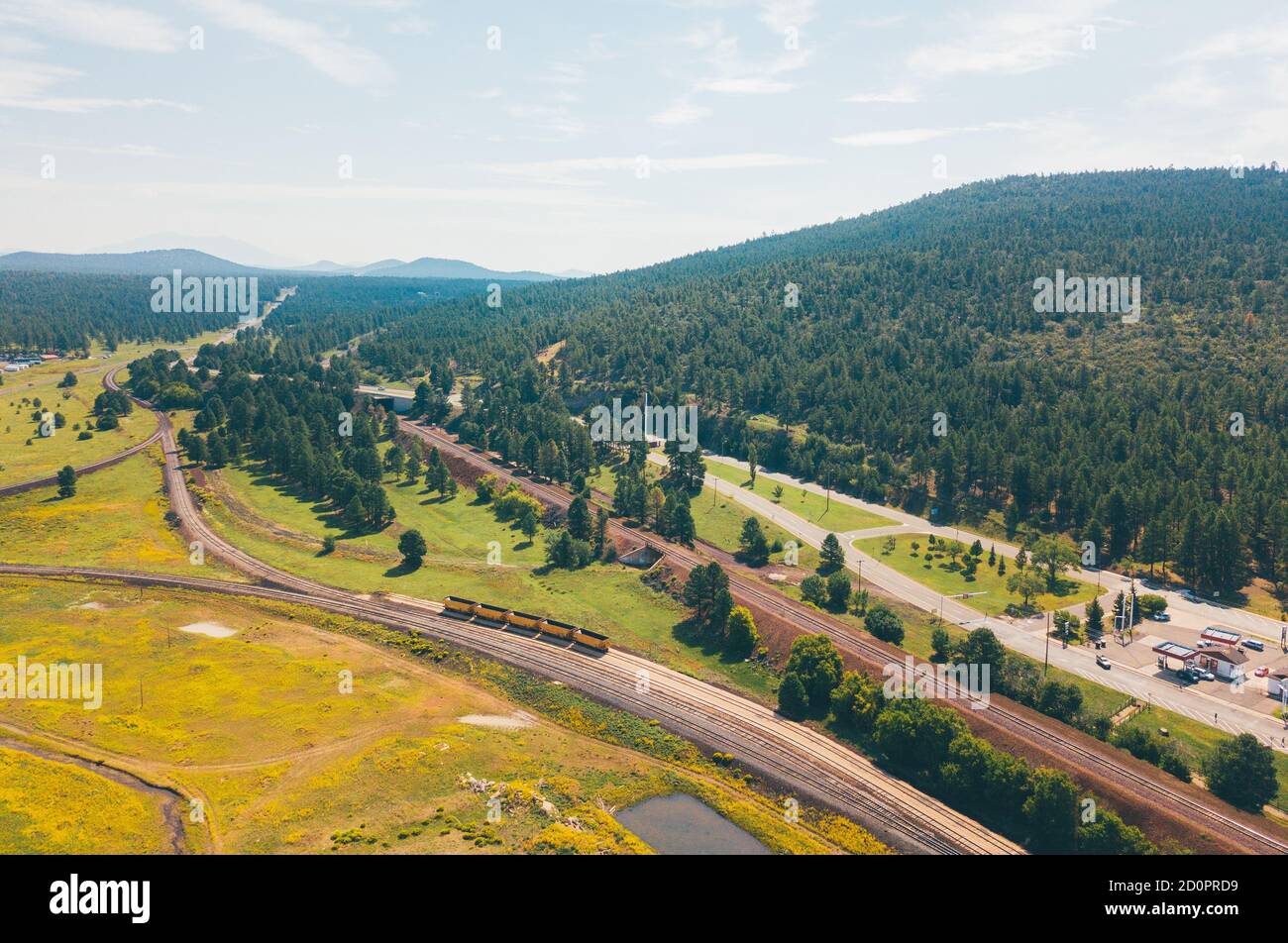 Aerial view of the Arizona forest and the American railway on a clear ...
