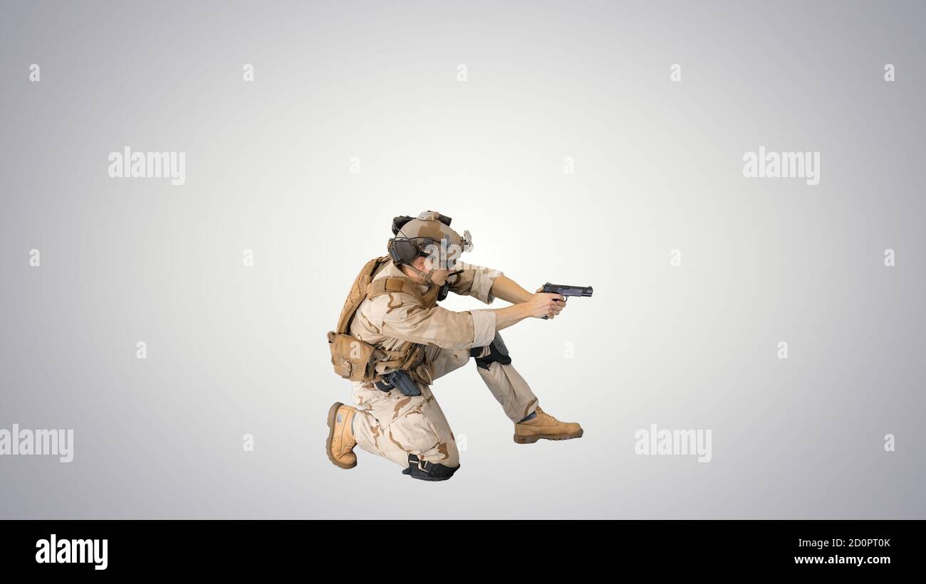 Soldier aiming and shooting sitting on his knee on gradient back Stock ...
