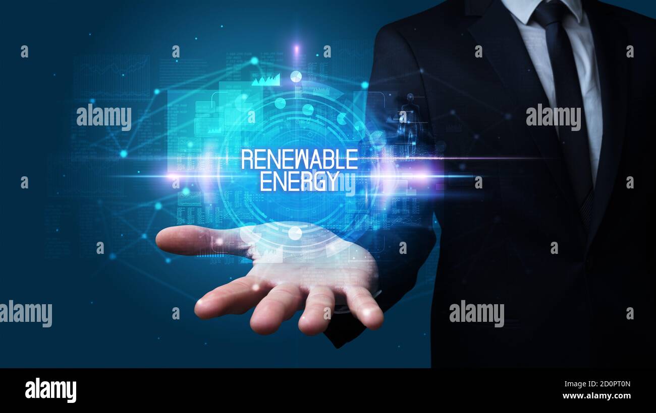 Man hand holding RENEWABLE ENERGY inscription, technology concept Stock ...