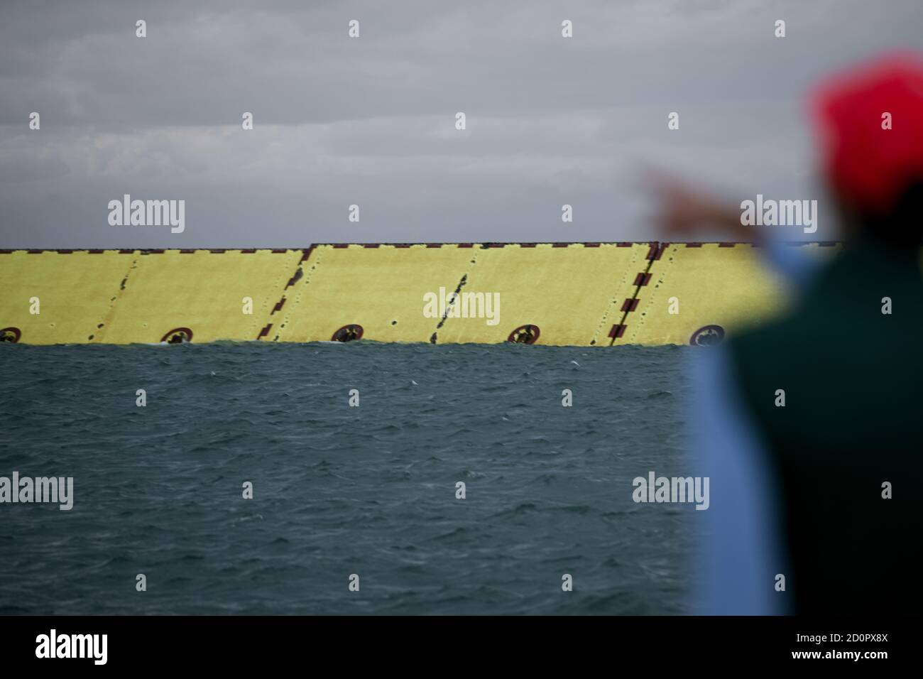 Venice, Italy - 3 October 2020: People look on at the Mose flood ...