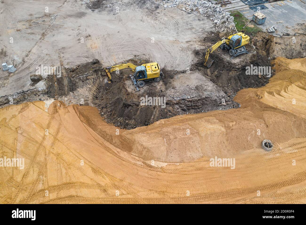 Aerial top view yellow excavator hi-res stock photography and images ...