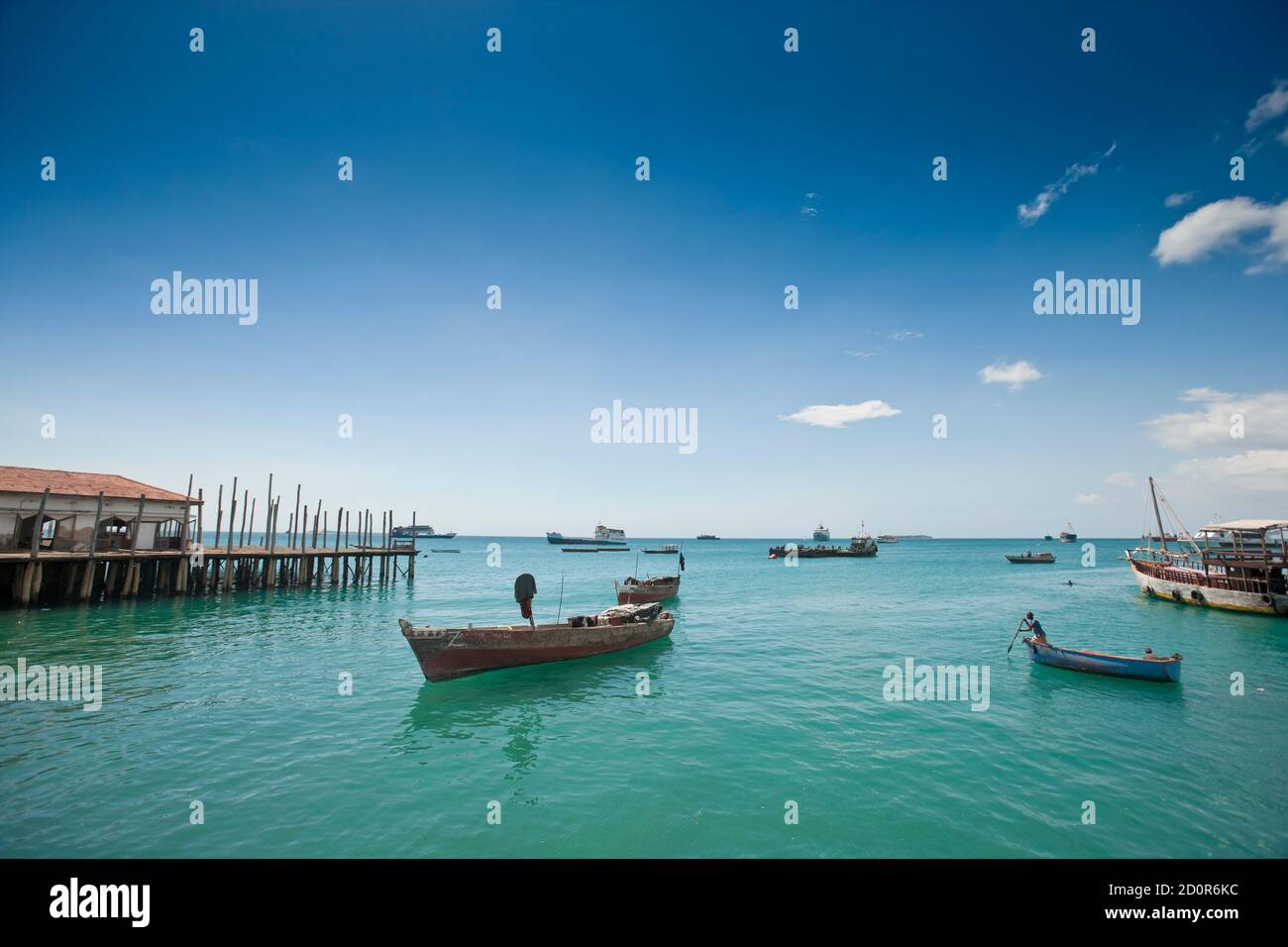Boats and people at the harbour of Stone Town, Zanzibar Stock Photo - Alamy