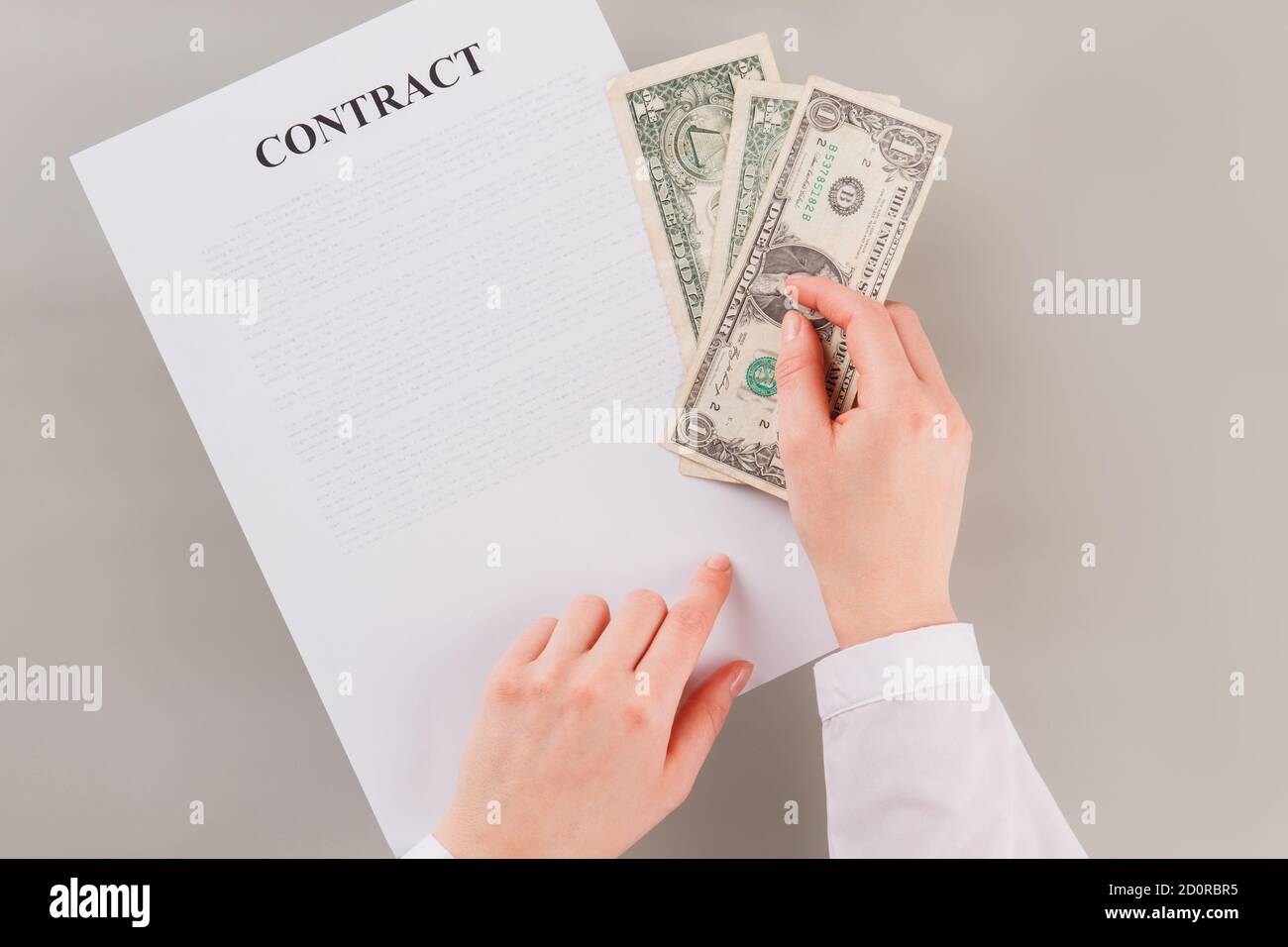 Business woman hands holding money and contract Stock Photo - Alamy
