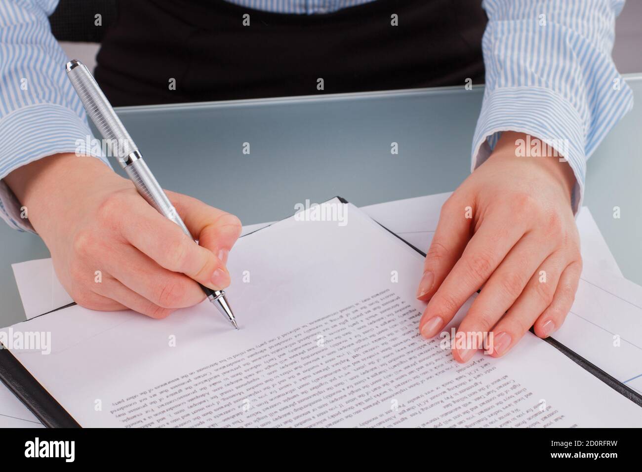 Business woman hands sign contract on desk Stock Photo - Alamy