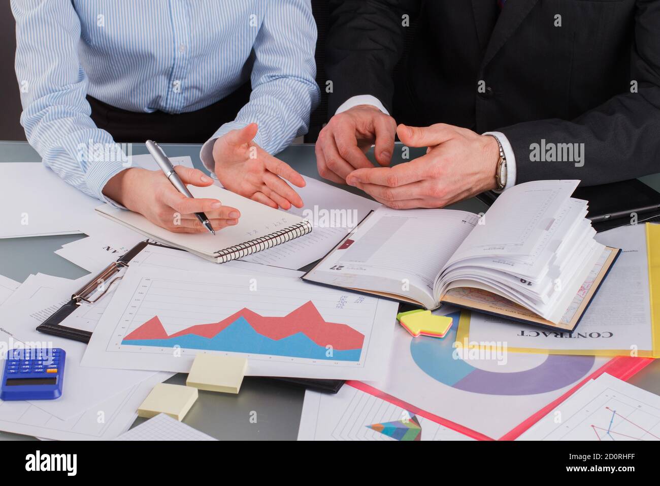 Business people working at office with financial report Stock Photo - Alamy