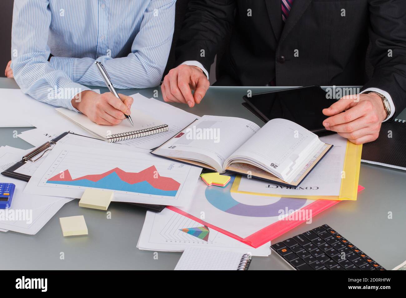 Two people analyzing charts hi-res stock photography and images - Alamy
