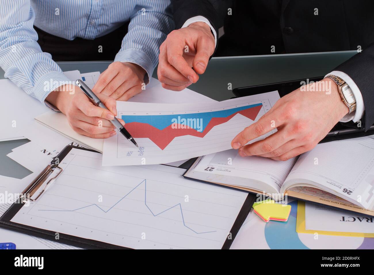 Business people checking financial data hi-res stock photography and ...