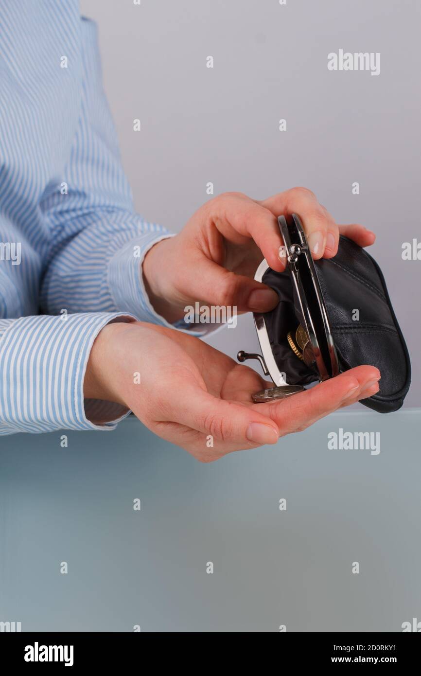 Woman putting euro coins hi-res stock photography and images - Alamy