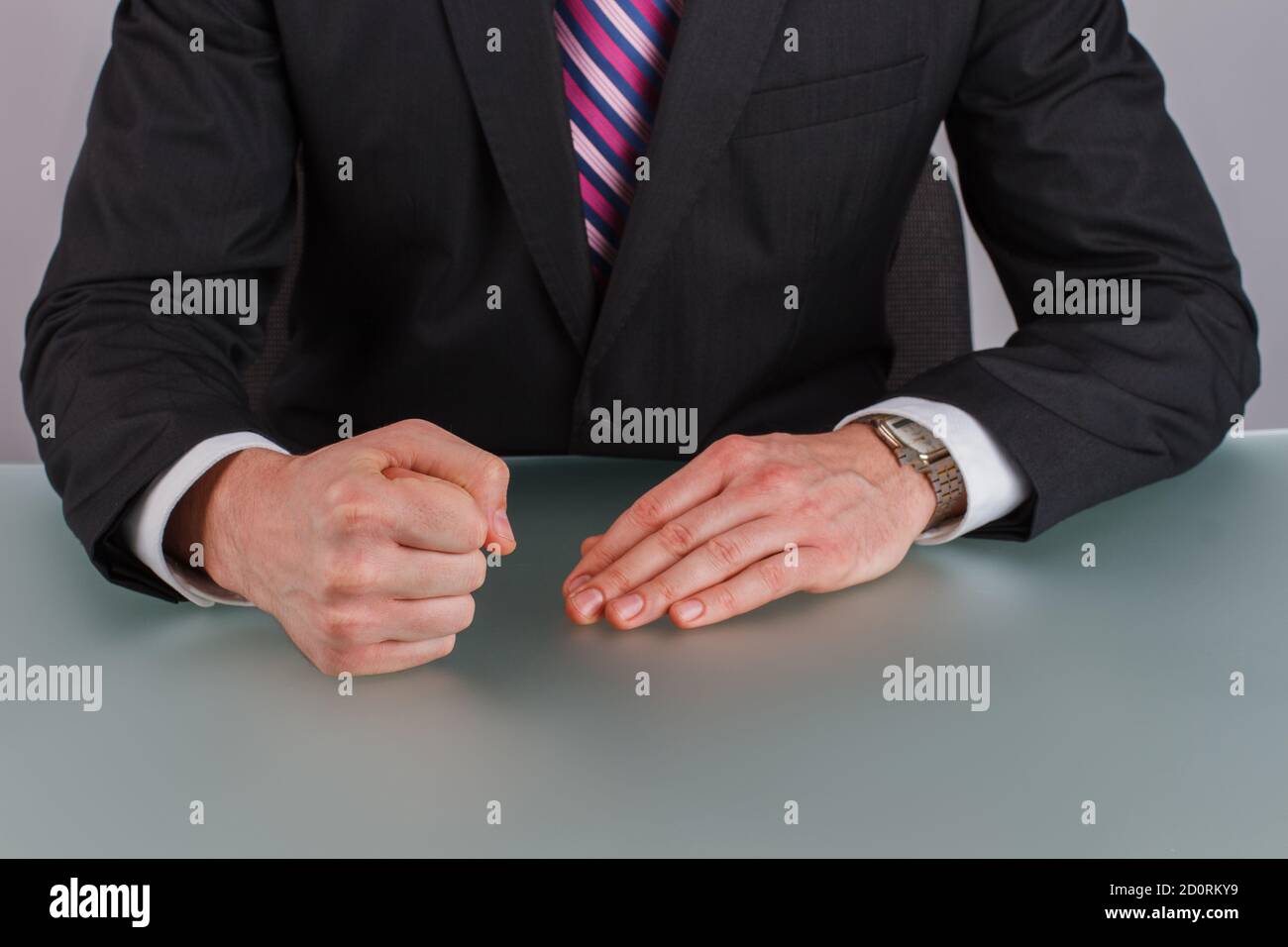 Clenched fist on table hi-res stock photography and images - Alamy