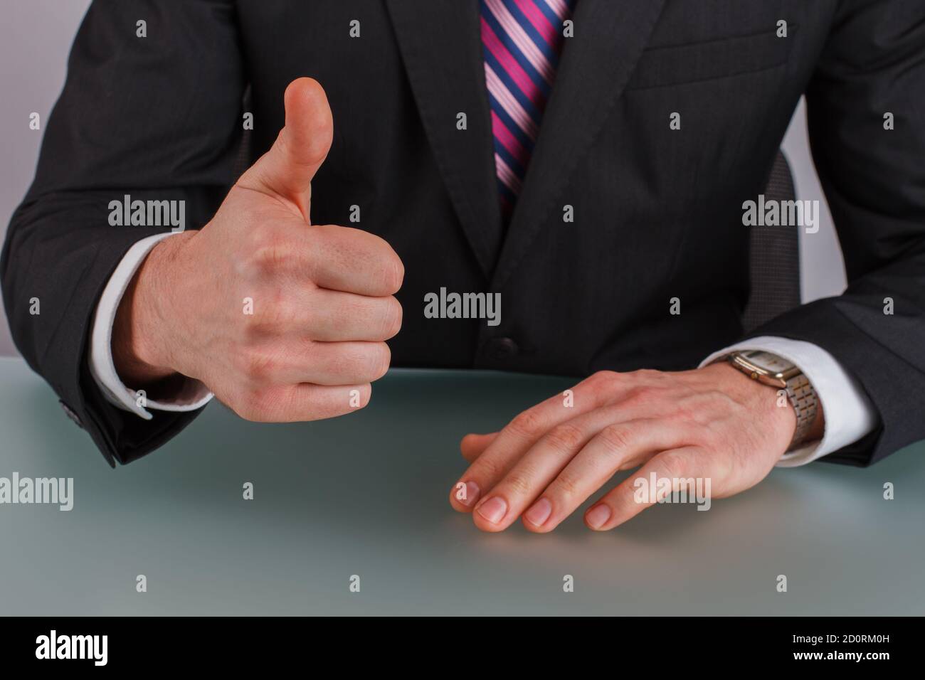 Close up businessman hand showing thumb up Stock Photo - Alamy