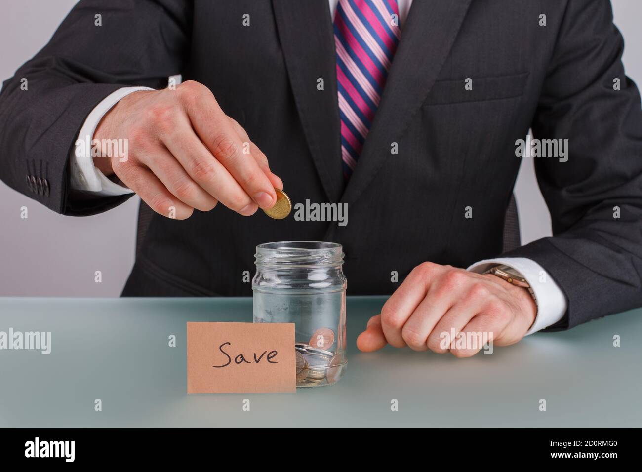 Money jar hand hi-res stock photography and images - Alamy