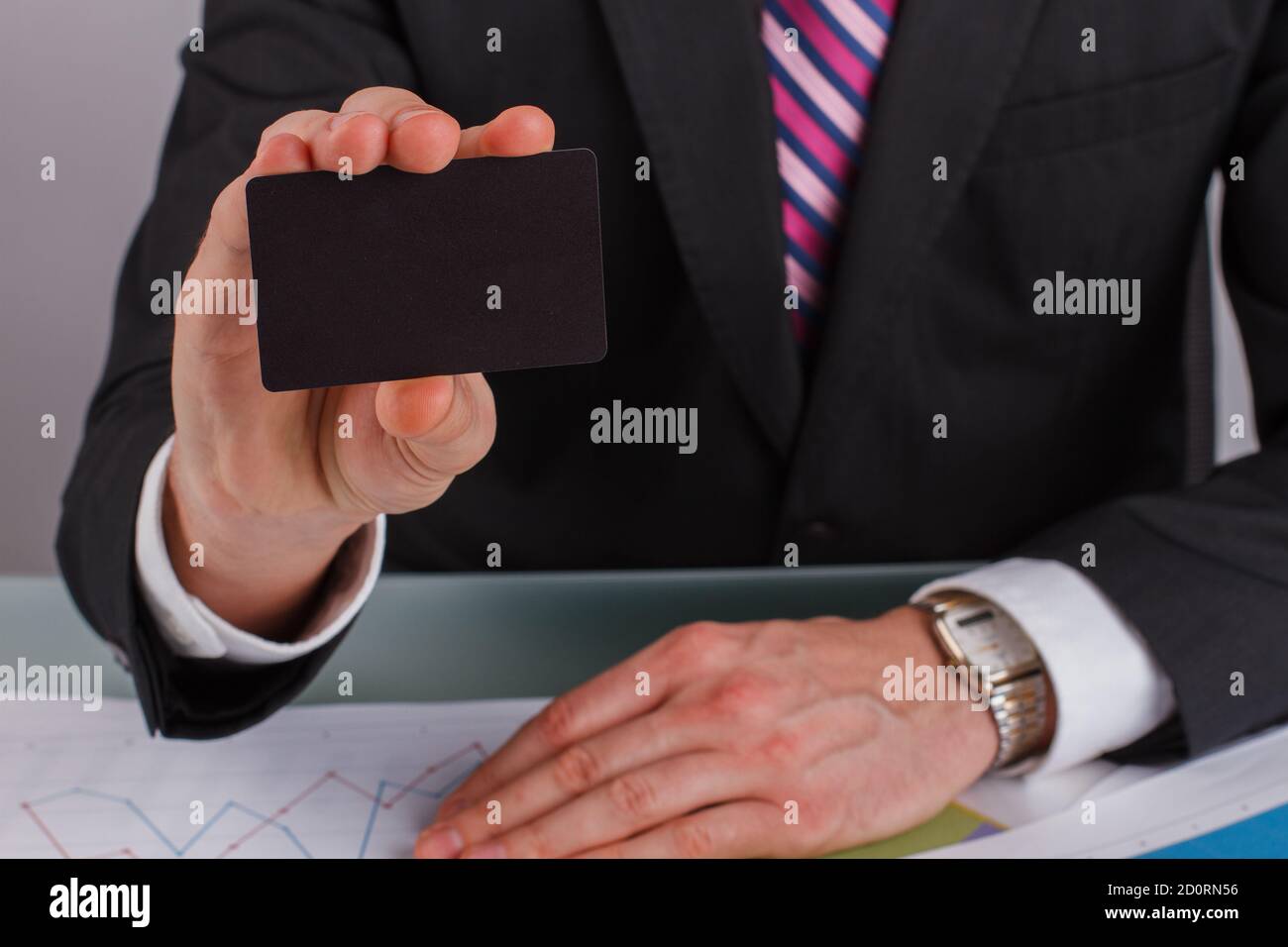Close up businessman hand showing business card Stock Photo - Alamy