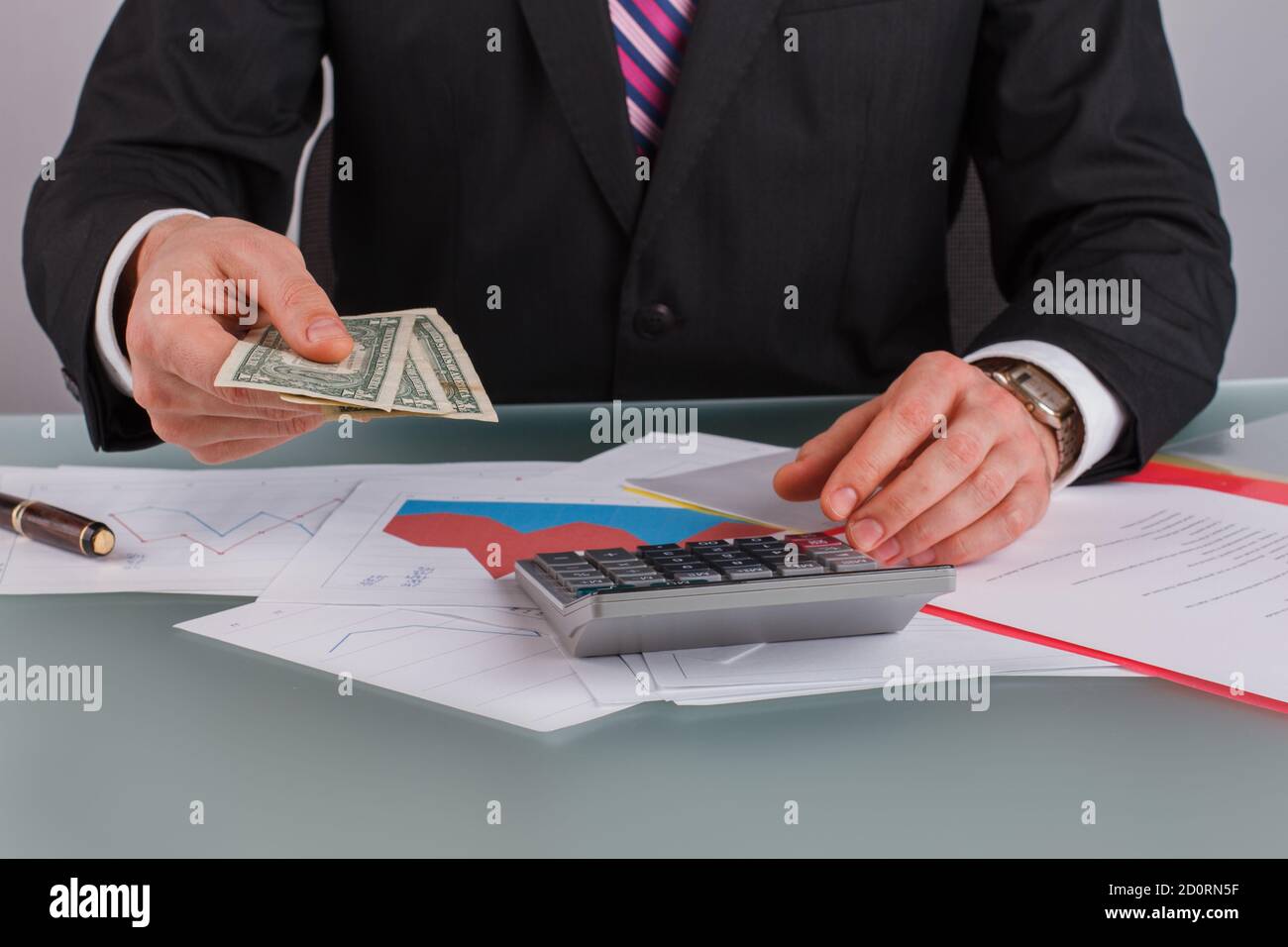 Close up male accountant counting money at office Stock Photo - Alamy