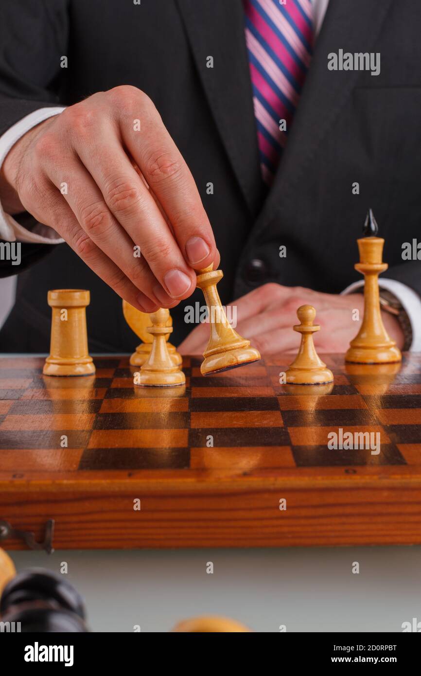 Man hand playing chess king hi-res stock photography and images - Alamy