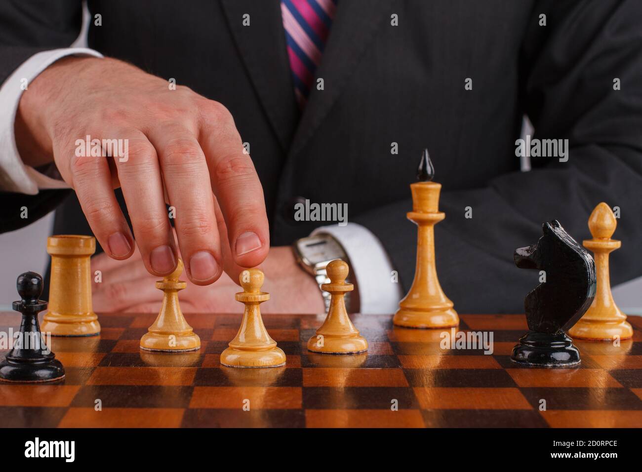 Hand holding chess piece hi-res stock photography and images - Alamy
