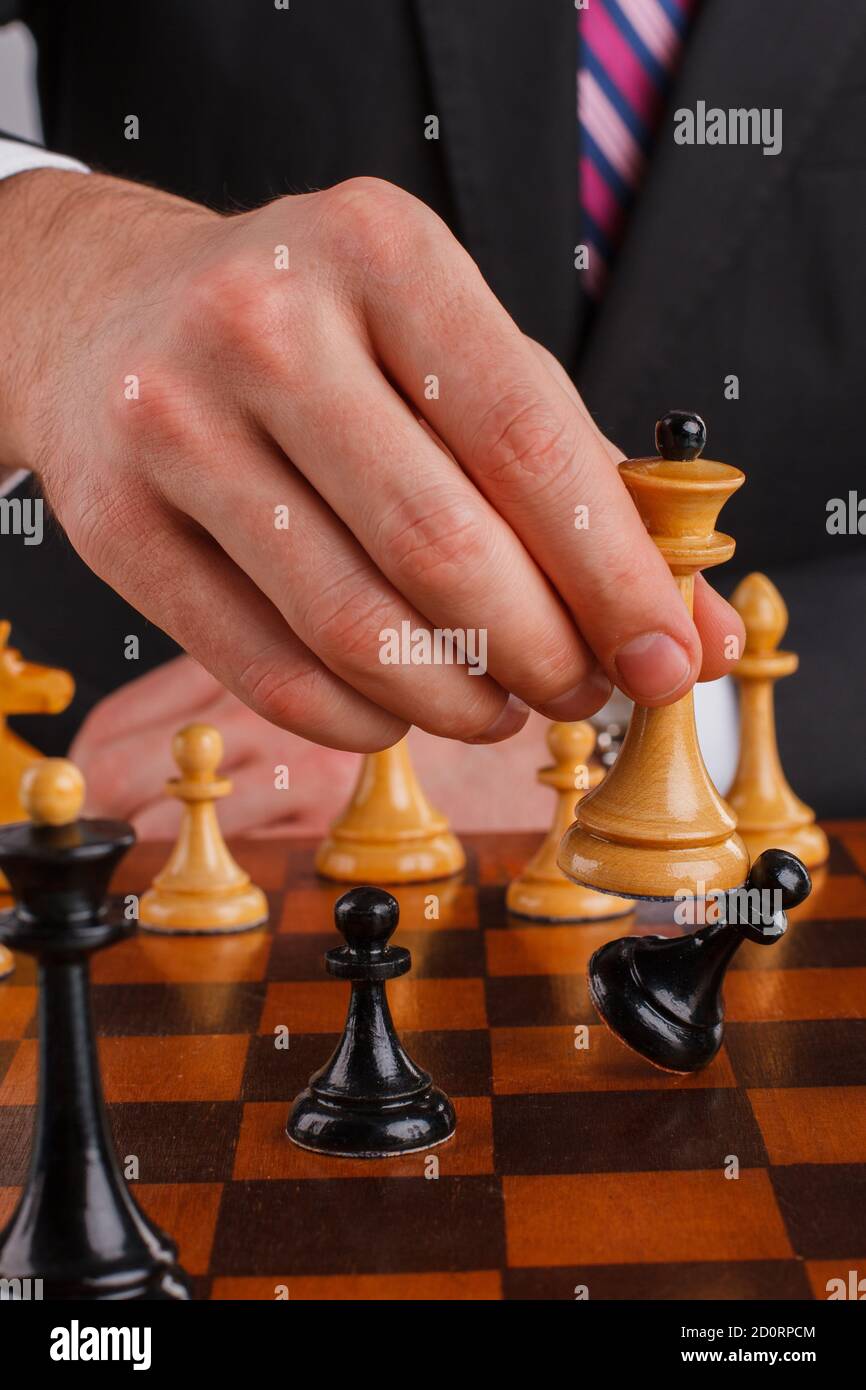 Hand businessman moving chess hi-res stock photography and images - Alamy