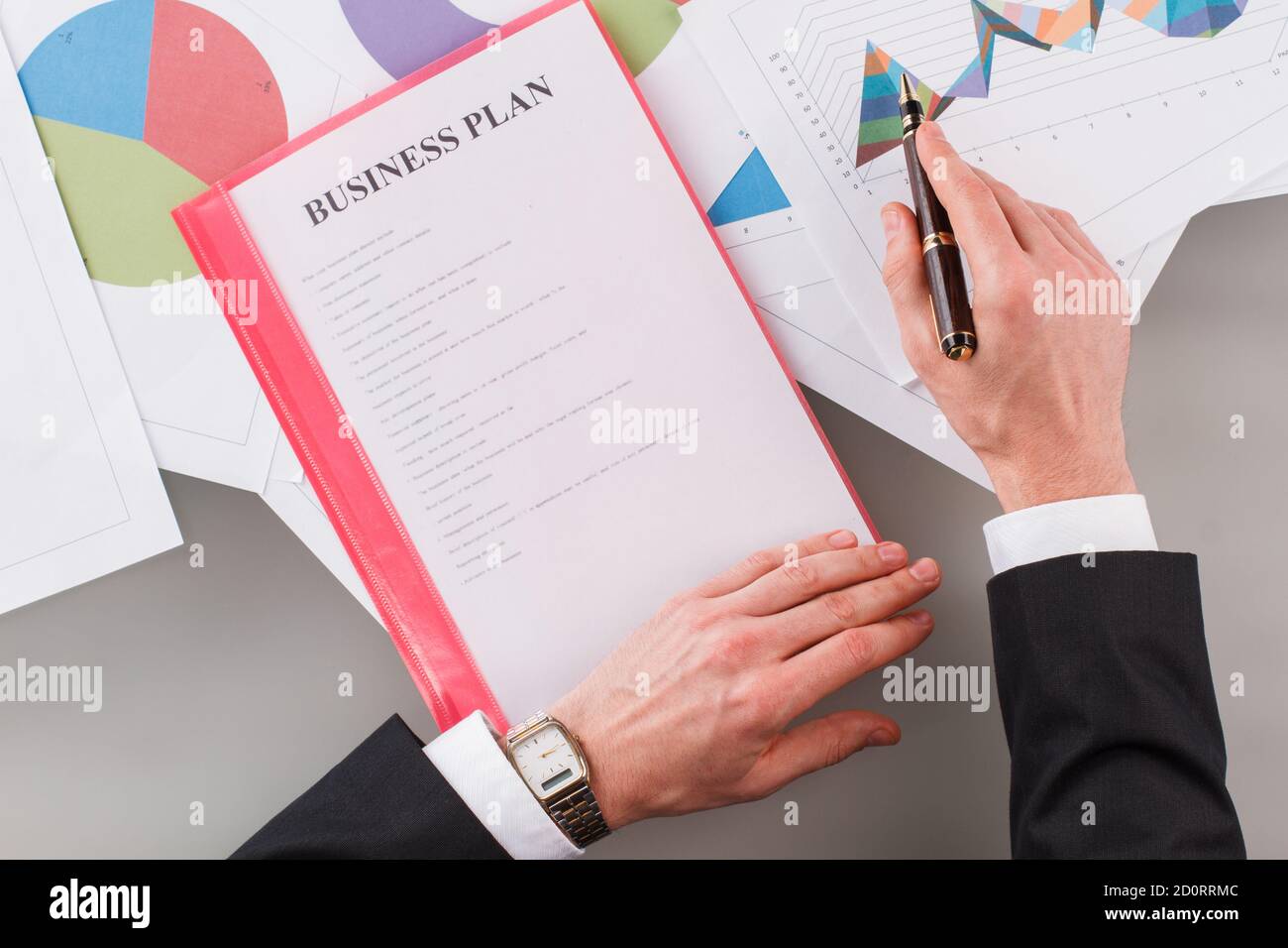 Folder charts graphs businessman hi-res stock photography and images ...