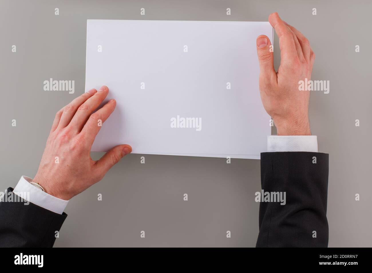 Businessman holding sheet of paper hi-res stock photography and images ...