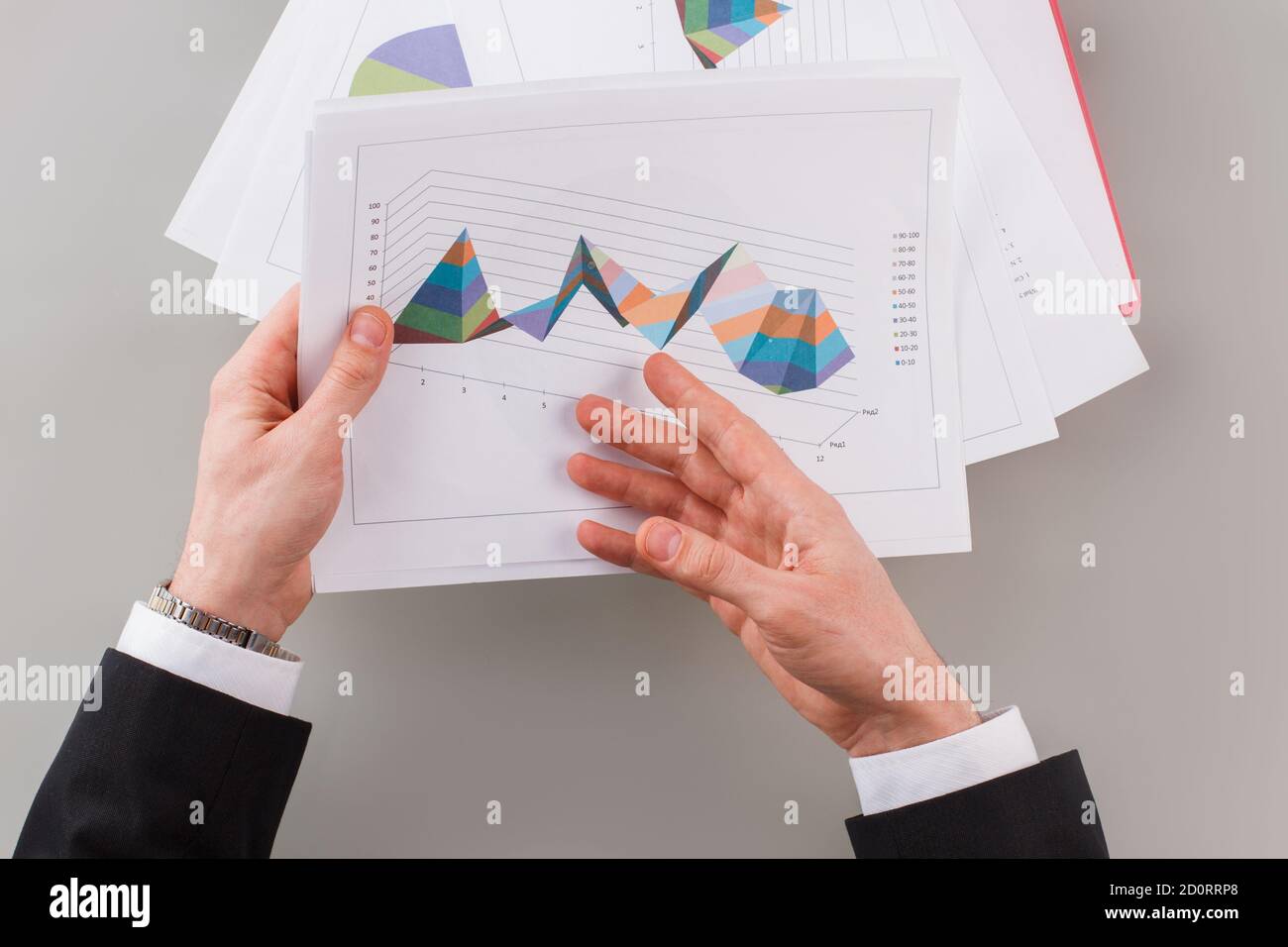 Financial analyst analysing income graphs Stock Photo - Alamy