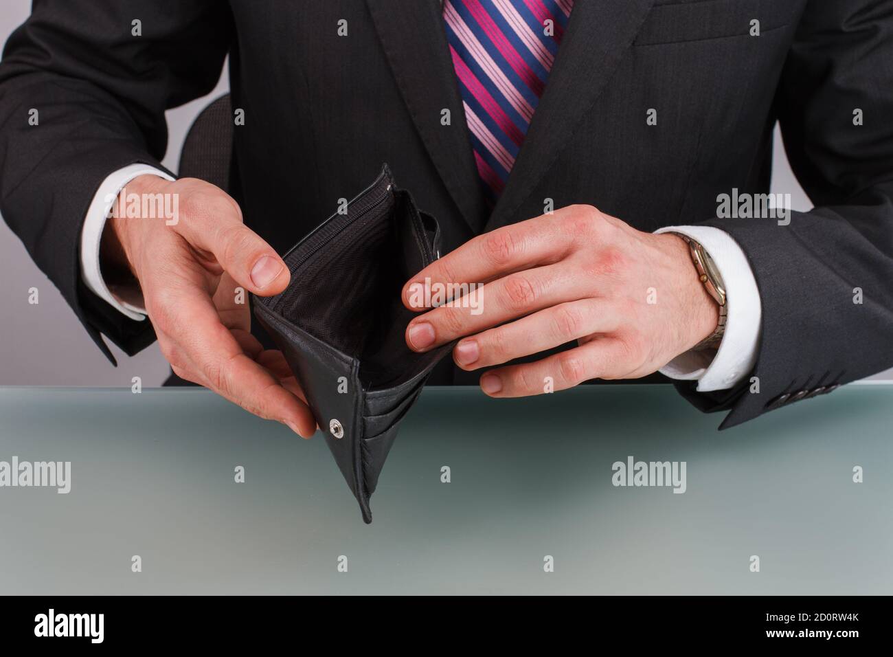 Empty wallet in mans hand Stock Photo - Alamy