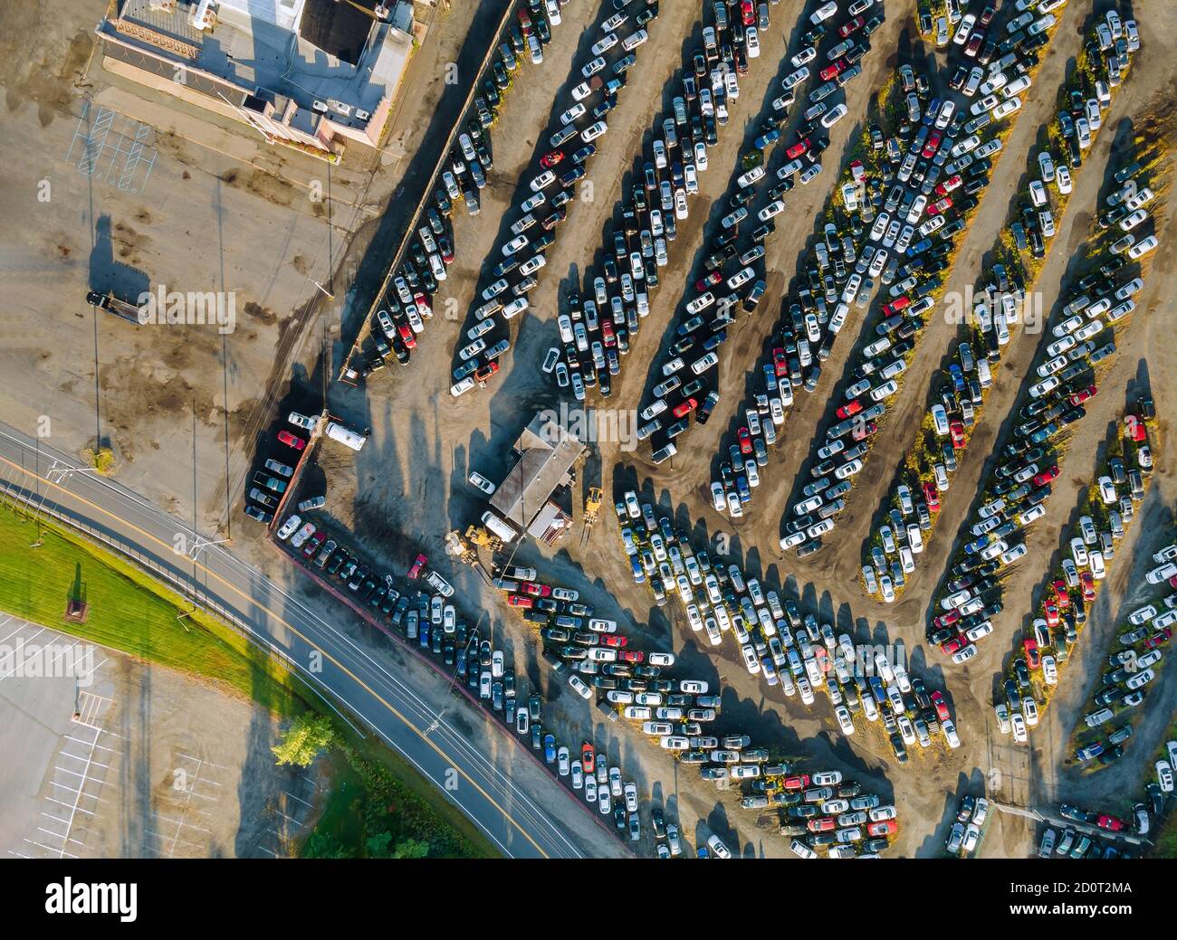Aerial view of many used car auction lot parked distributed in a ...