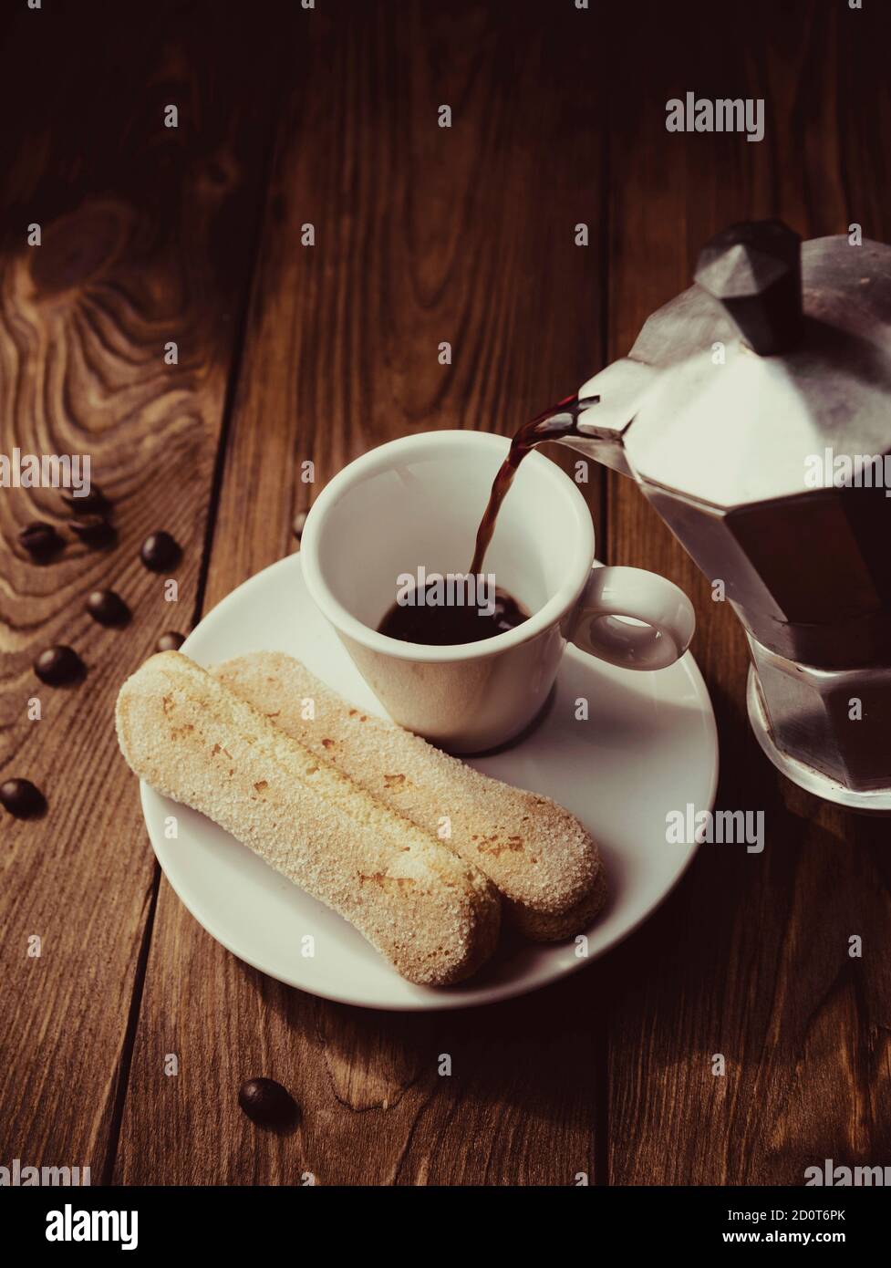 Pouring coffee out of italian coffee pot Stock Photo - Alamy