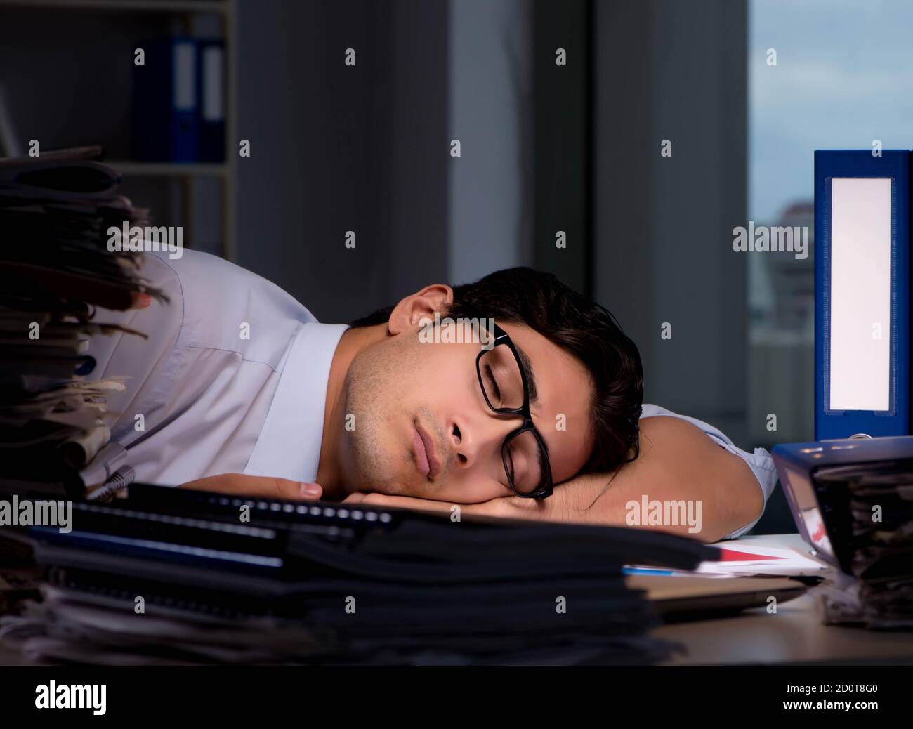 The young businessman working overtime late in office Stock Photo - Alamy