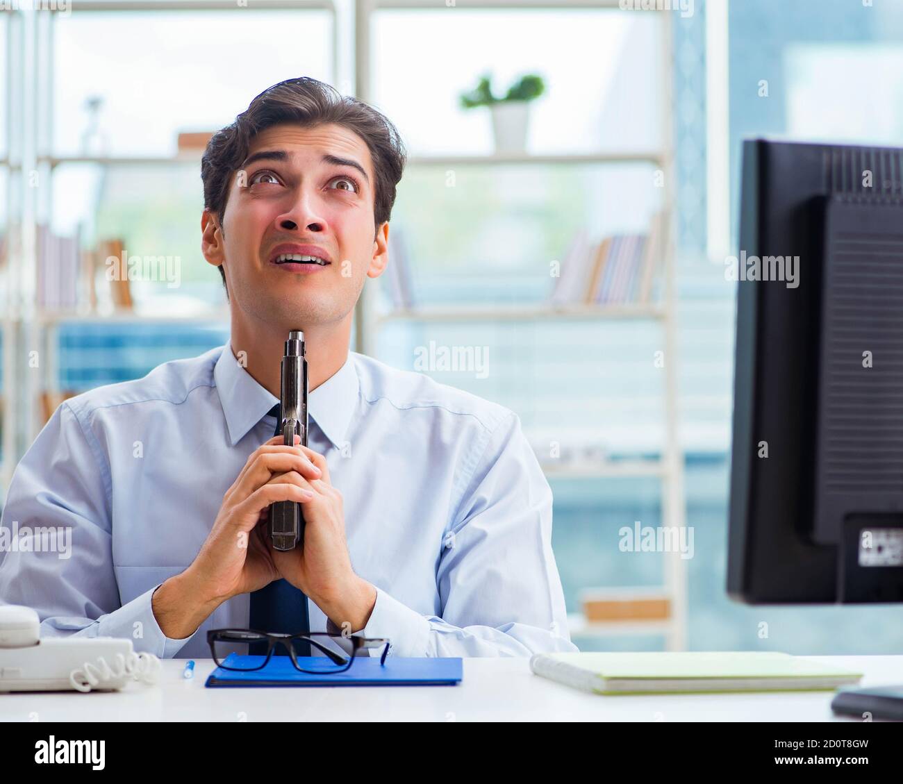 The angry businessman with gun thinking of committing suicide Stock ...