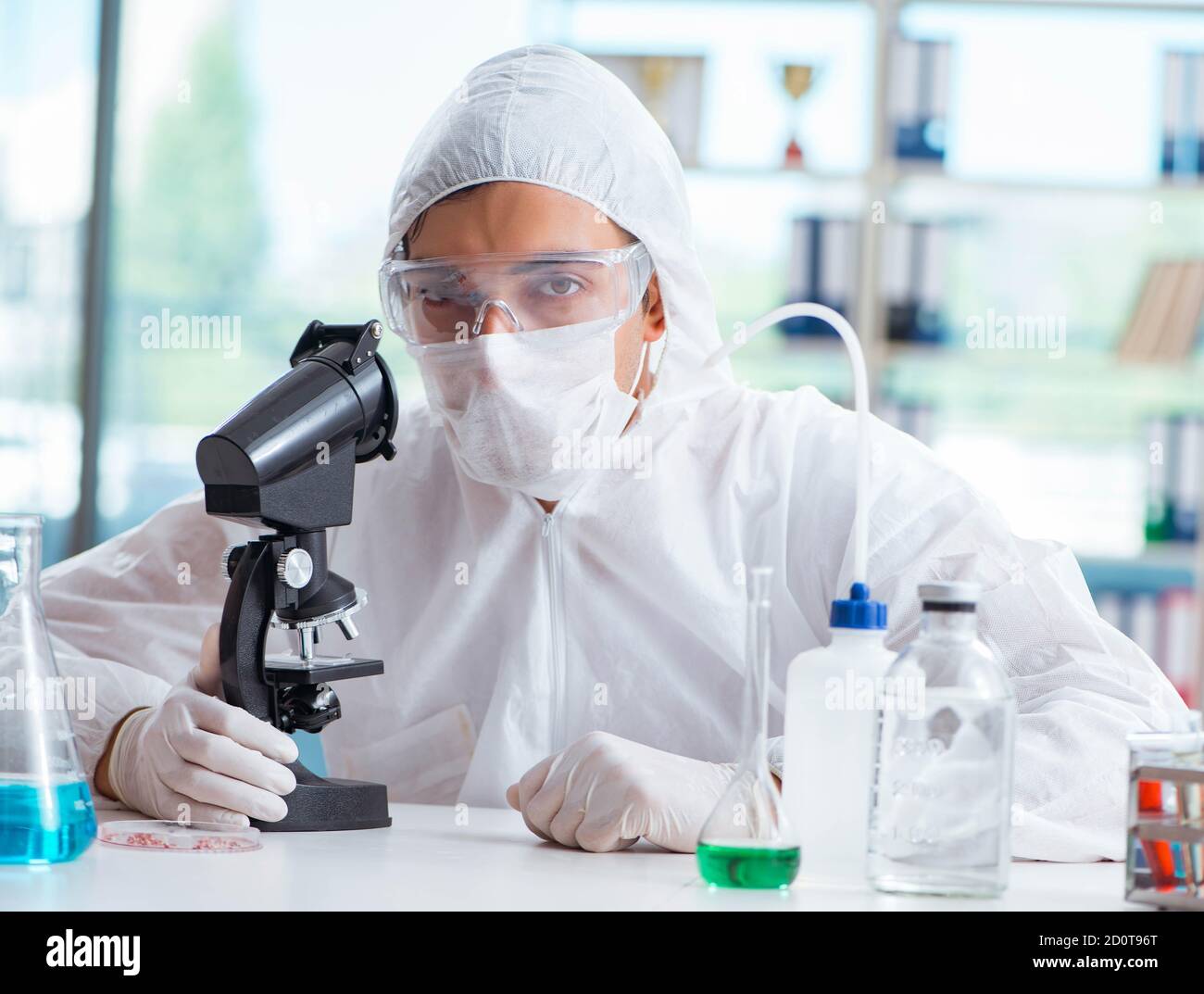 The chemist working in the laboratory with hazardous chemicals Stock ...