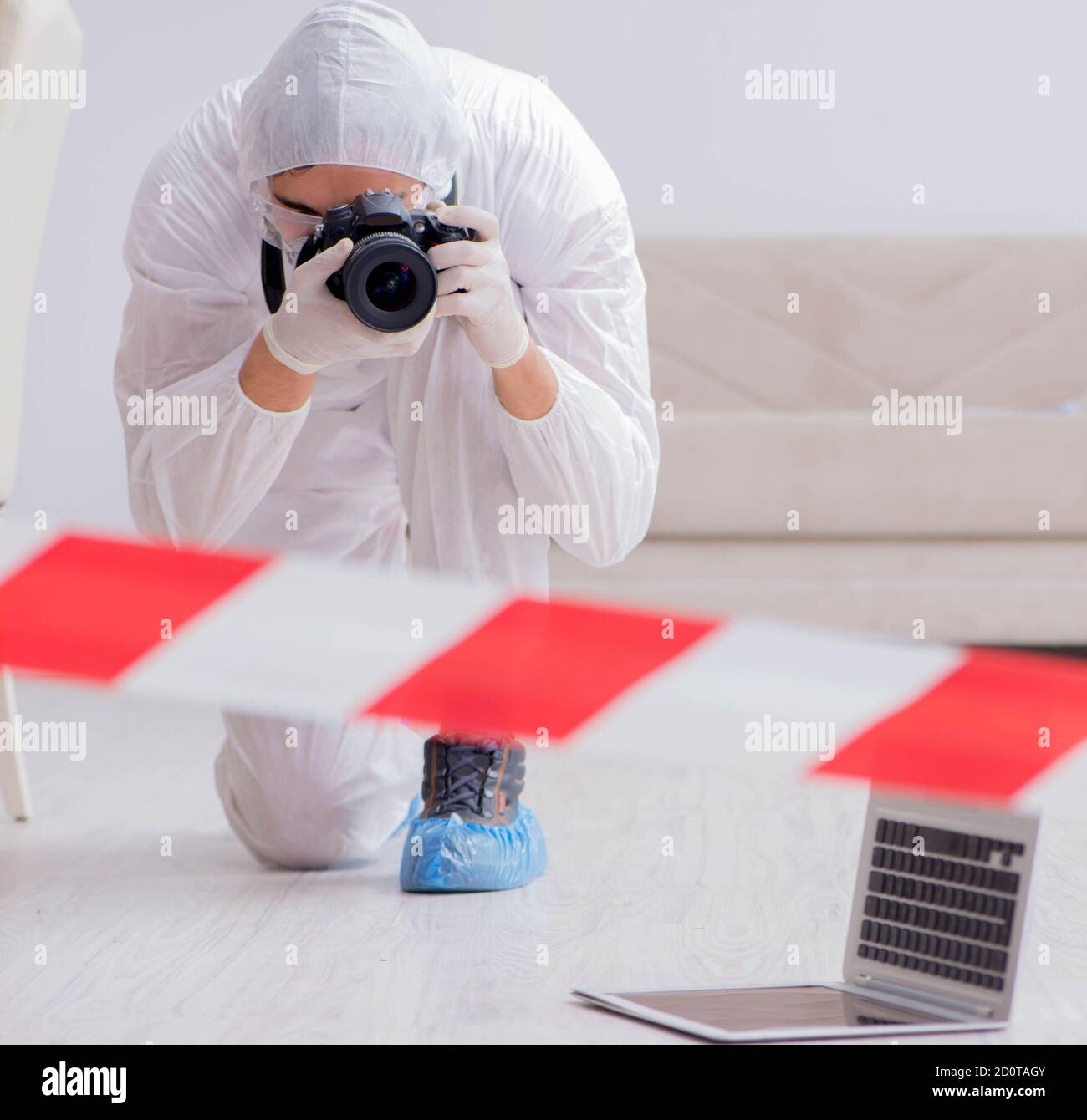 Forensic expert at crime scene doing investigation hi-res stock ...