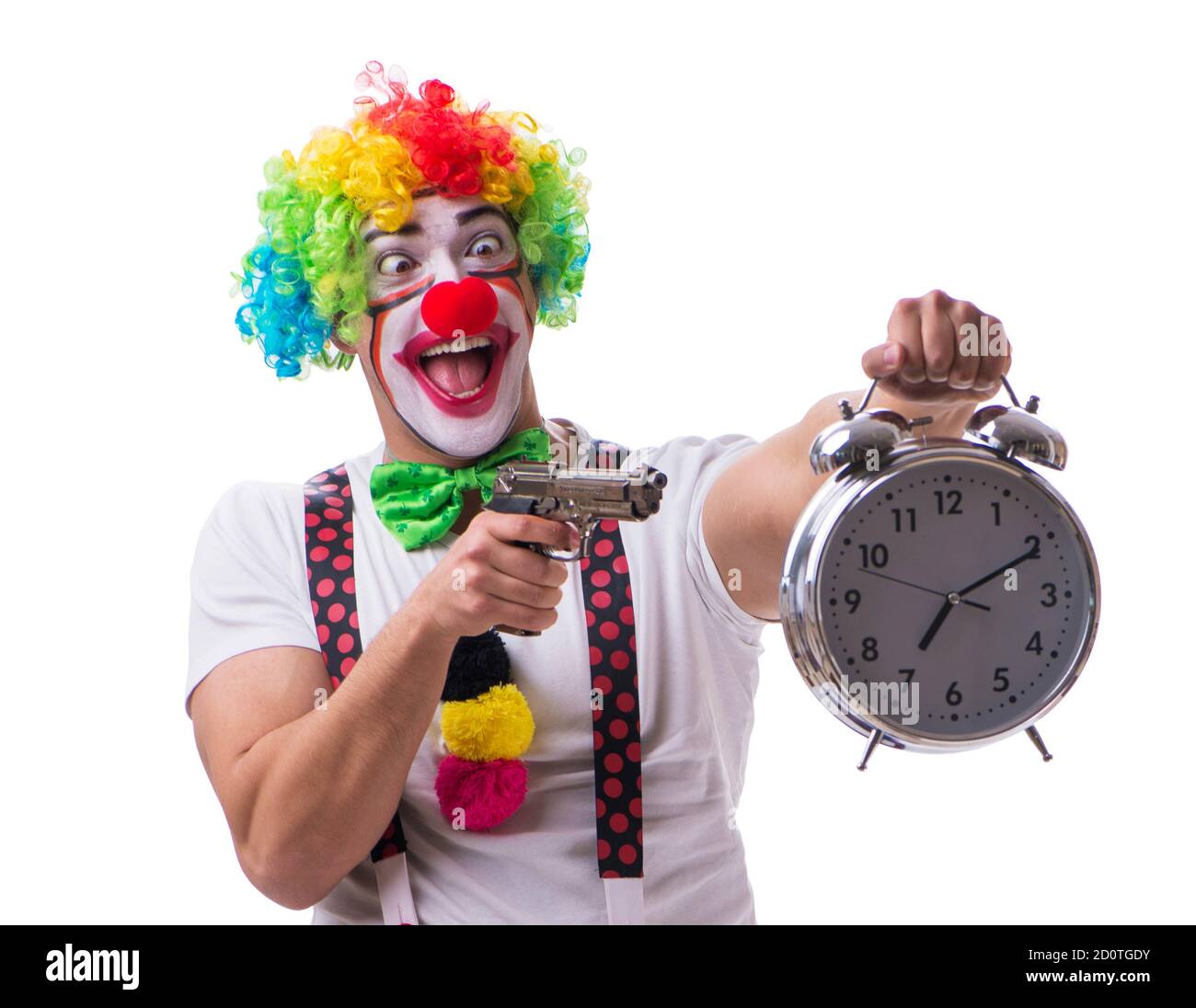 The funny clown with an alarm clock isolated on white background Stock ...