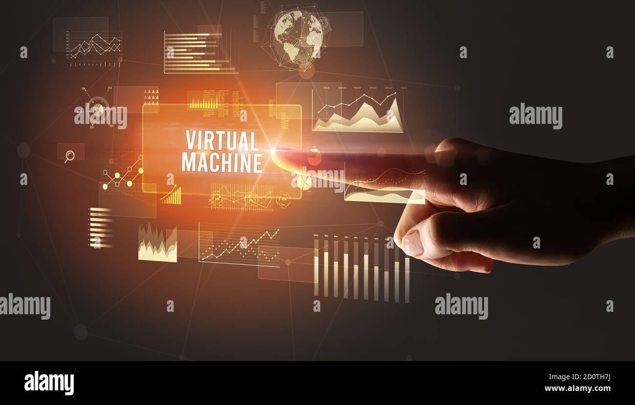 Hand touching VIRTUAL MACHINE inscription, new business technology ...