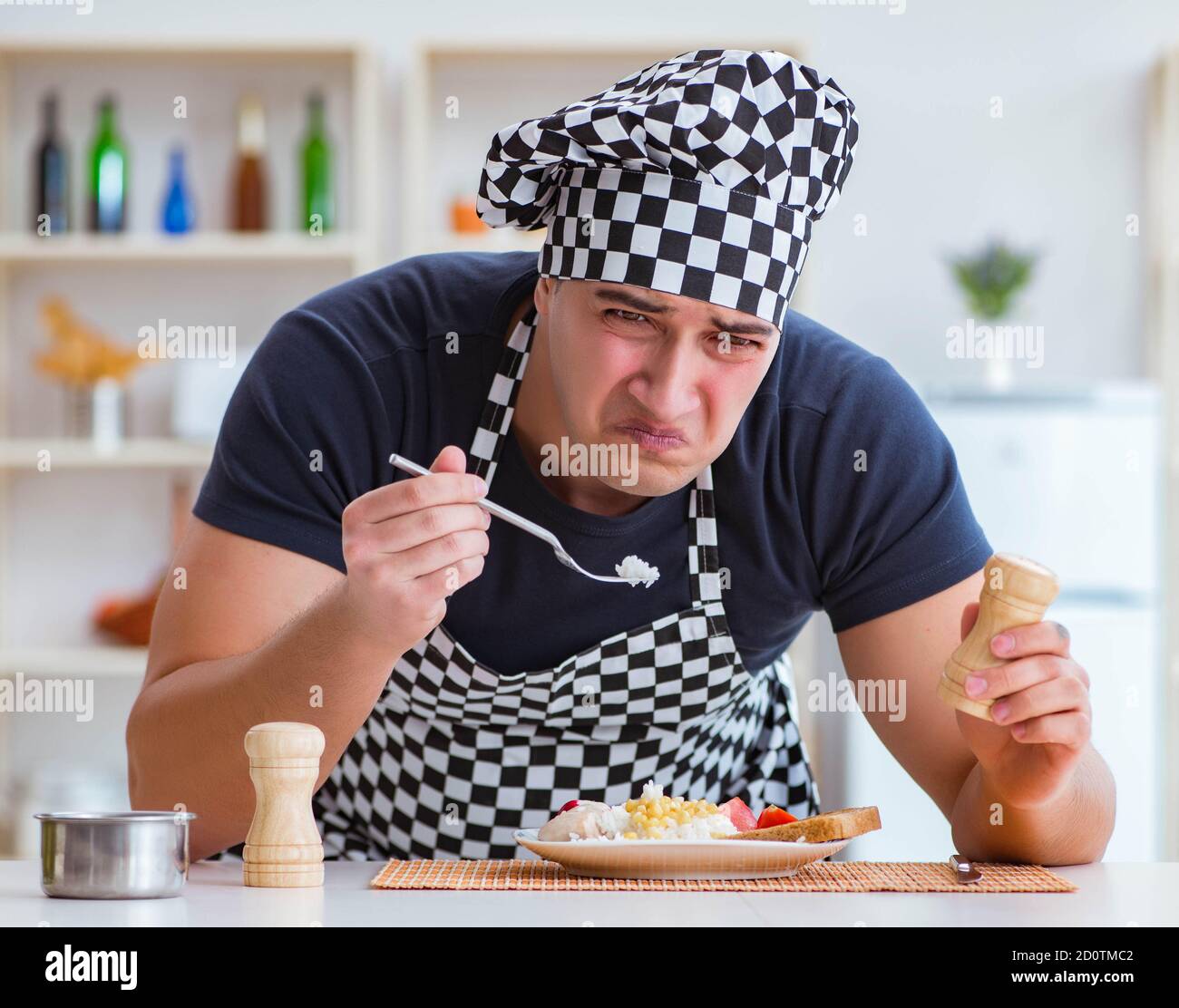 The chef cook cooking a meal breakfast dinner in the kitchen Stock ...
