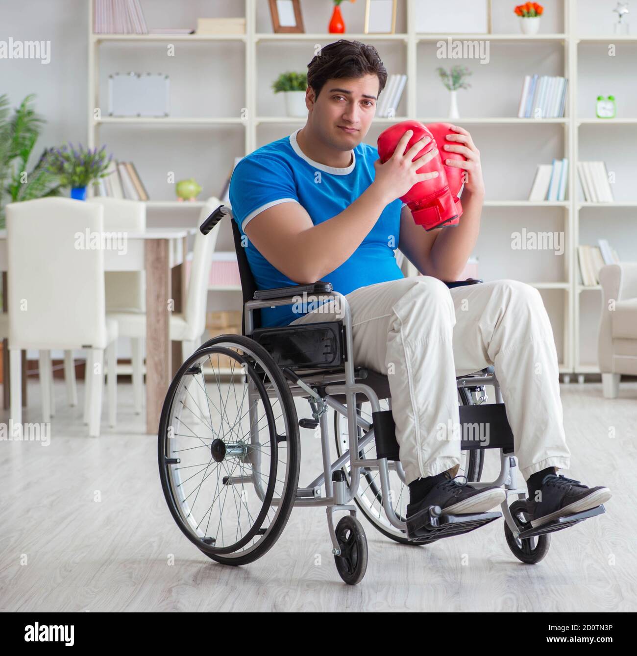 The disabled boxer at wheelchair recovering from injury Stock Photo - Alamy
