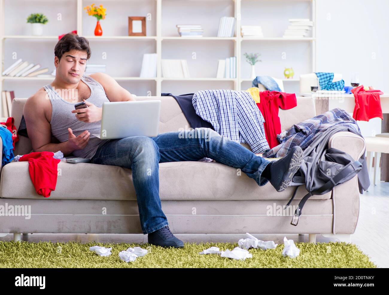 The young man working studying in messy room Stock Photo - Alamy