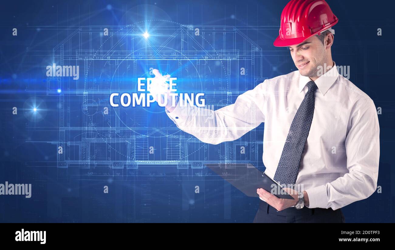 Handsome architect with helmet drawing EDGE COMPUTING inscription, new ...