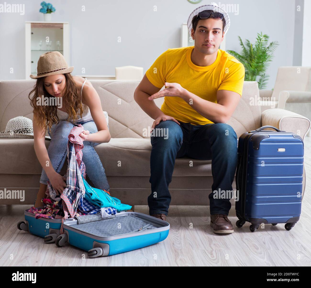 The young family preparing for travel vacation Stock Photo - Alamy