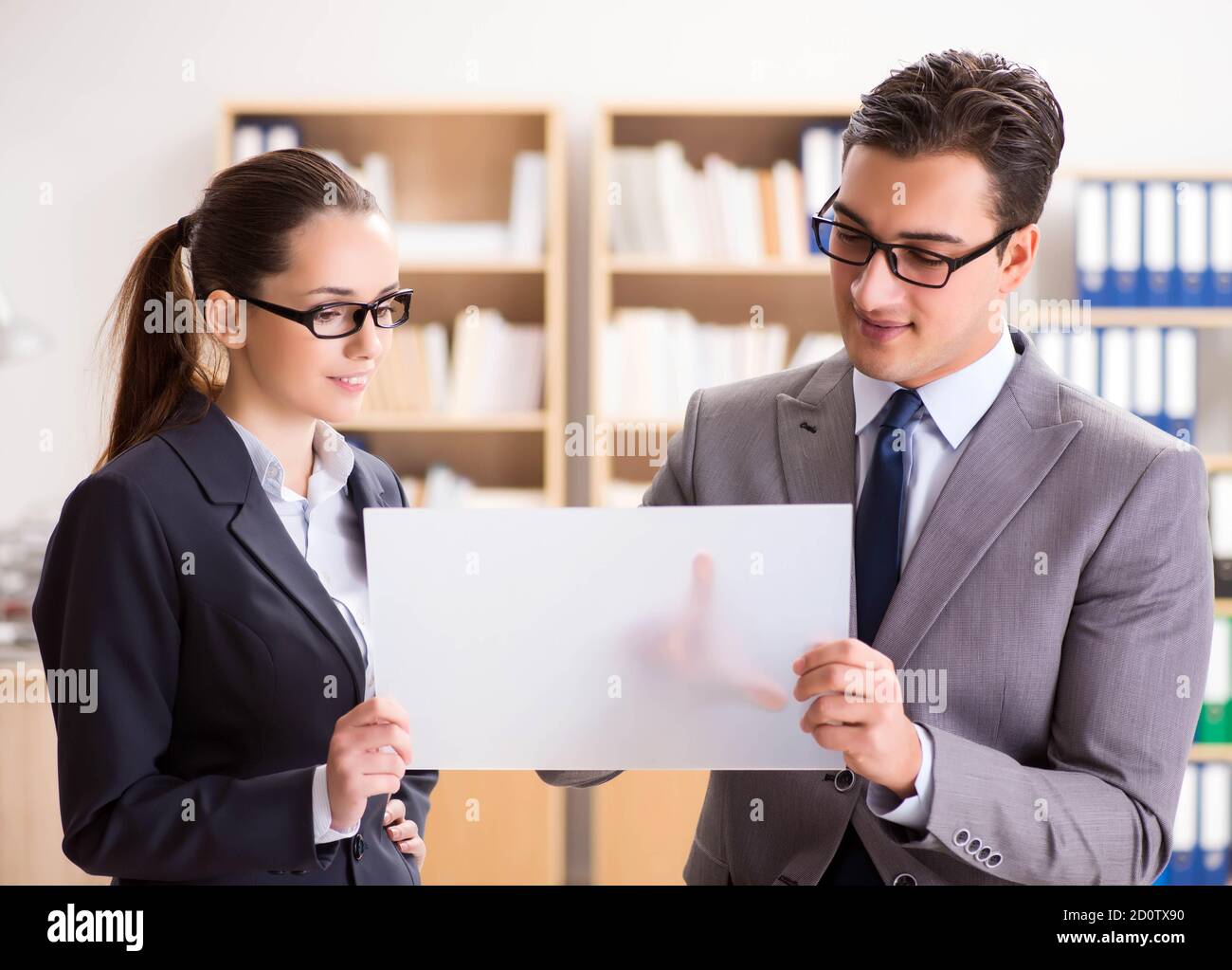 The businessman and businesswoman having discussion in office Stock ...