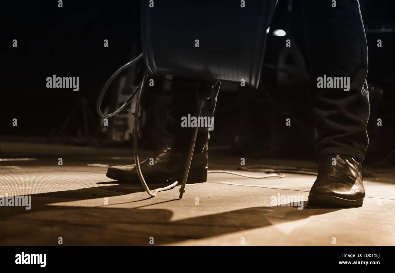 Singer feet in a concert, detail of live music Stock Photo - Alamy