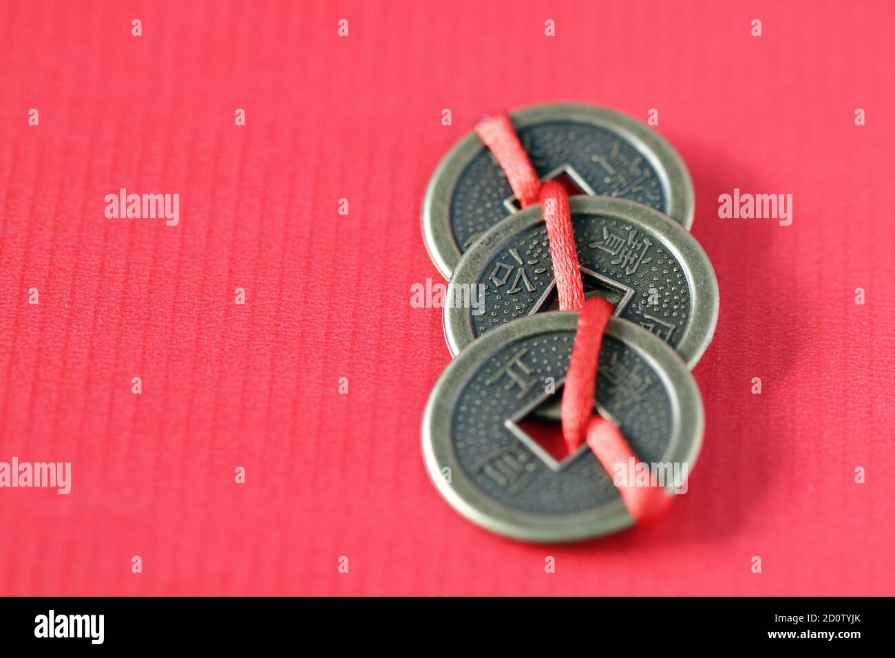 Chinese coins red ribbon hi-res stock photography and images - Alamy